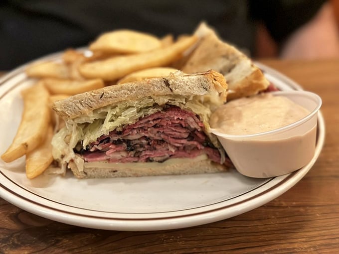 Architecture in sandwich form—layers of pastrami stacked with the precision of a Jenga master. The accompanying fries aren't sidekicks; they're co-stars in this delicious production.