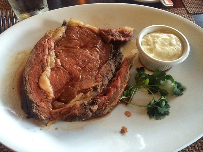 Prime rib perfection – a rosy interior that would make even the most stoic diner weak at the knees. That parsley garnish isn't just for show. 