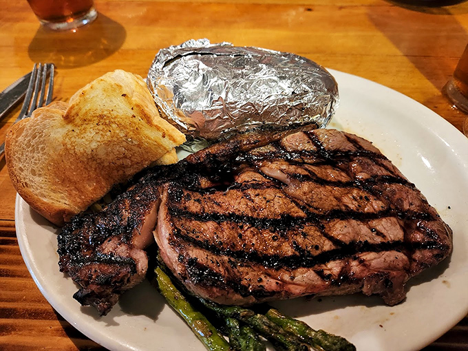 This isn't just steak – it's edible artwork with grill marks. The perfectly charred exterior gives way to a blush-pink interior that whispers, "Worth the drive."