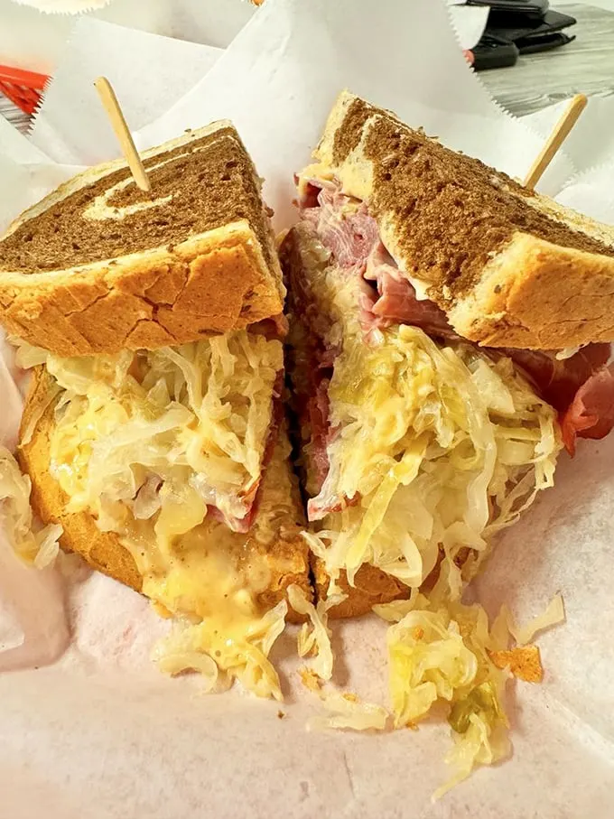 The legendary Reuben in all its glory—where corned beef, sauerkraut, and Swiss cheese perform a perfectly choreographed dance on rye.