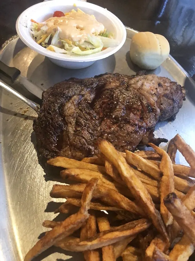 Ribeye steak platter: Behold the showstopper—a perfectly seared ribeye that makes fancy city steakhouses seem like overpriced pretenders. Worth every penny and calorie.