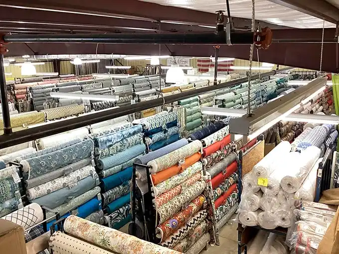 Fabric canyon explorers, take note: these towering rolls contain enough material to redecorate an entire neighborhood of Southern mansions.