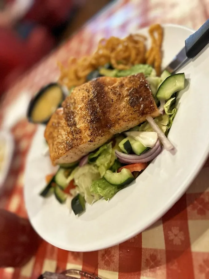 A salmon salad that proves healthy eating doesn't have to be punishment – fresh greens, perfectly cooked fish, and enough avocado to keep California jealous.