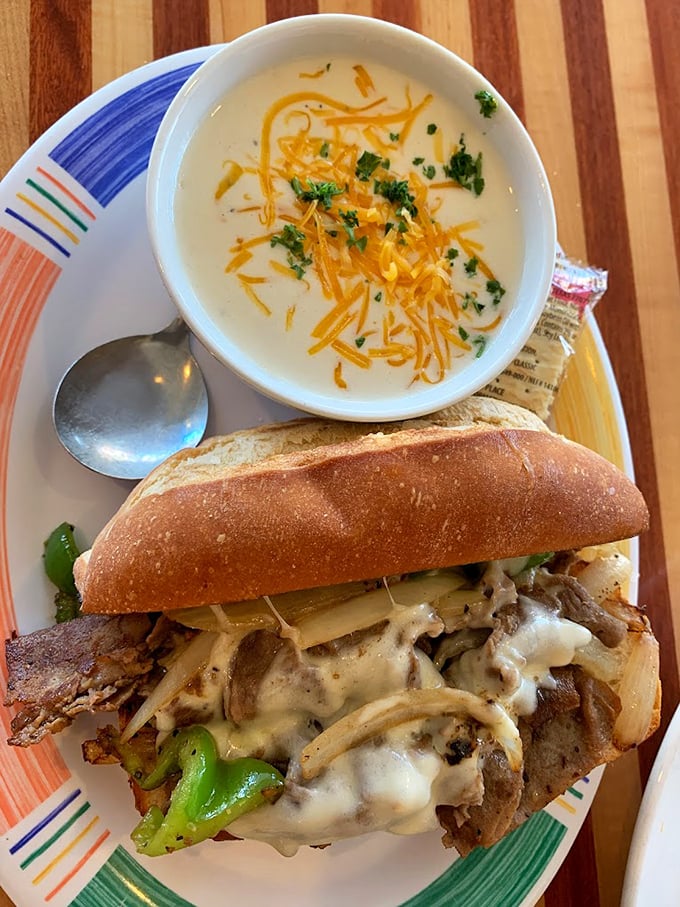 This isn't just a sandwich – it's architecture with melted cheese. Paired with a creamy soup topped with shredded cheddar, it's comfort food elevated to an art form.