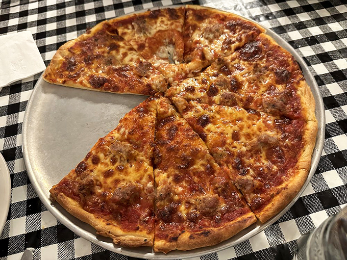 This sausage pizza isn't trying to reinvent the wheel—it's just perfecting it. The cheese-to-sauce ratio is what mathematicians call "the golden delicious."