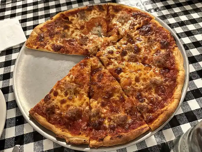This sausage pizza isn't trying to reinvent the wheel—it's just perfecting it. The cheese-to-sauce ratio is what mathematicians call "the golden delicious."