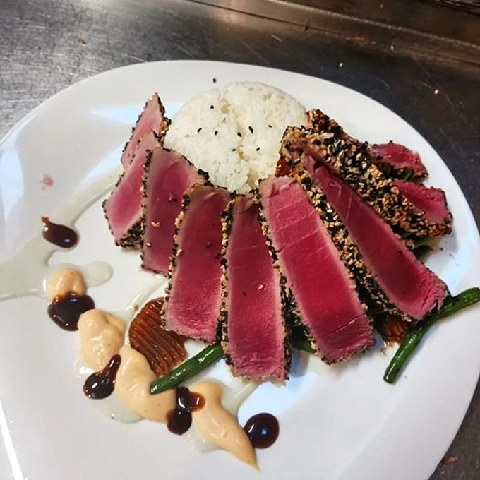 This sesame-crusted tuna isn't just perfectly seared—it's the kind of dish that makes you wonder why you'd ever eat anywhere else.