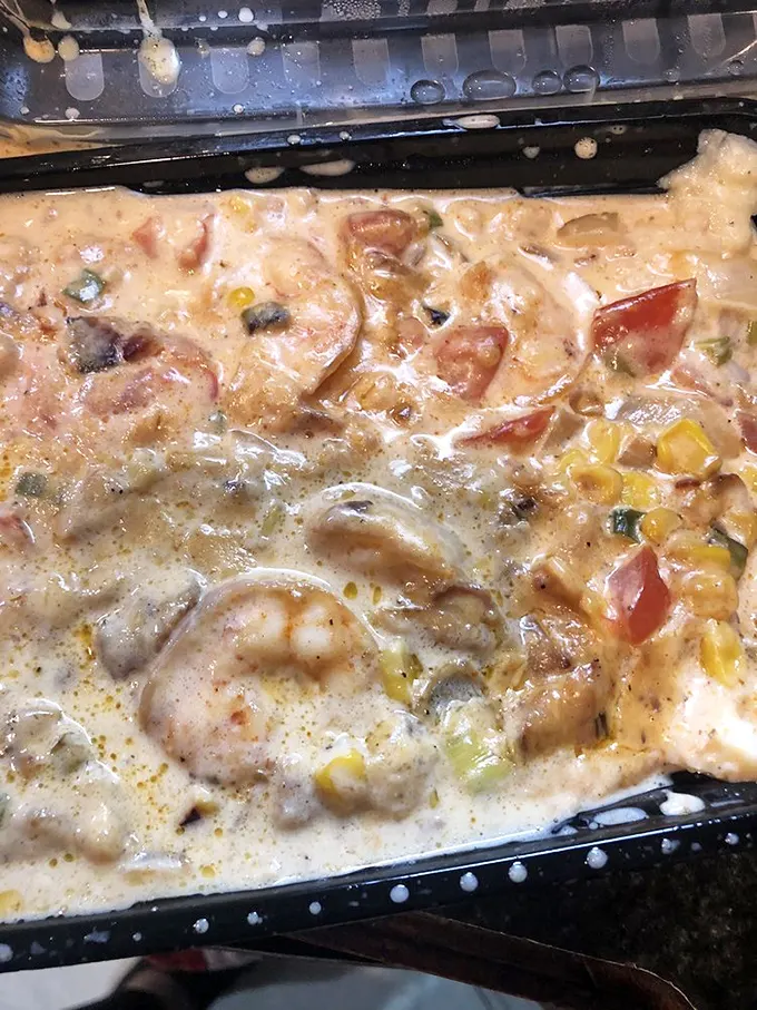 This isn't just shrimp and grits—it's a creamy, dreamy Southern symphony with plump shrimp and colorful vegetables playing the starring roles.