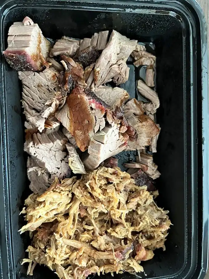 Meat candy in its purest form. The brisket's bark and the pulled pork's tender strands are like the Lennon and McCartney of barbecue—brilliant separately, transcendent together.