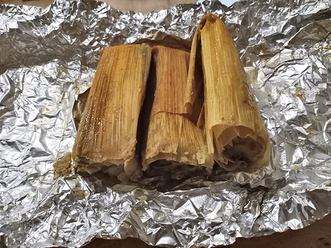 These corn husk-wrapped bundles of joy aren't just tamales – they're time machines to authentic Mexican home cooking, steamed to perfection and ready for unwrapping.