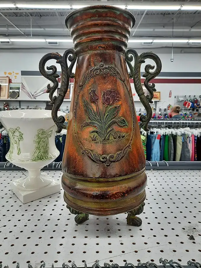 This ornate copper vase isn't just decorative—it's storytelling in metal form. Someone's discarded elegance becomes your conversation piece.