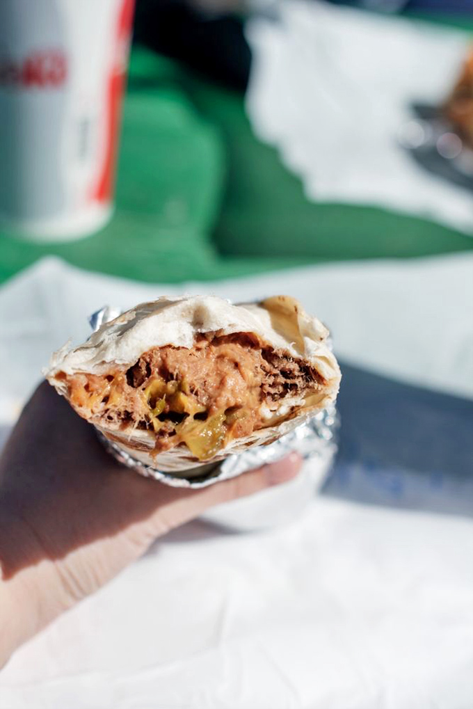 That moment when the burrito reveals its soul – layers of spicy, savory goodness that make you wonder why you'd ever eat anything else.