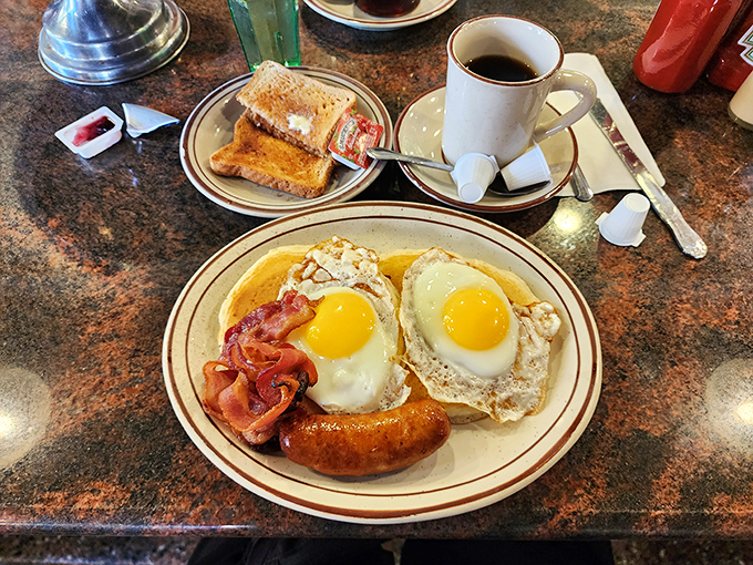 Two sunny-side-up eggs with perfectly crisped bacon—the breakfast that's launched a thousand New York mornings and cured countless late nights.