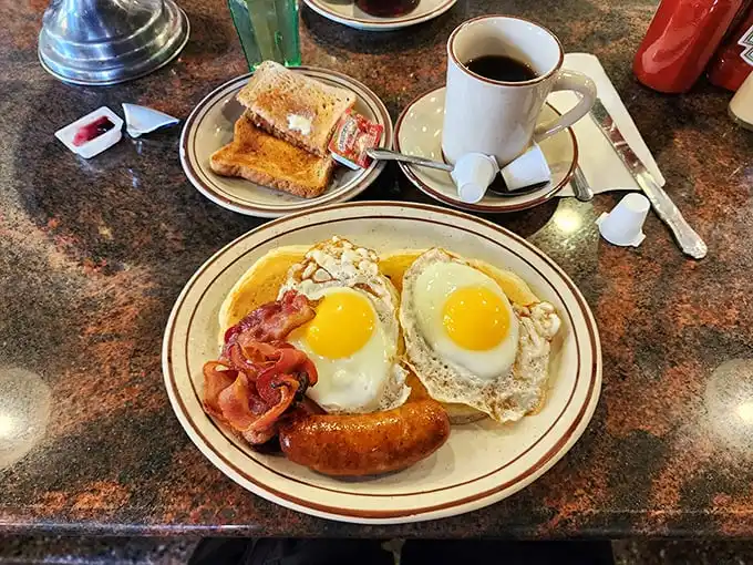 Two sunny-side-up eggs with perfectly crisped bacon—the breakfast that's launched a thousand New York mornings and cured countless late nights.