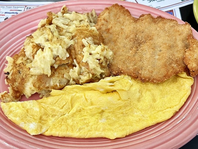 A breakfast trinity so perfect it deserves its own holiday: golden hash browns that crackle, eggs cooked with respect, and a pork tenderloin for morning champions.