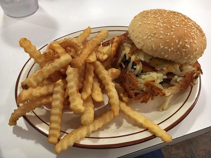 This isn't just a burger; it's edible nostalgia served with a side of golden, perfectly crispy fries that snap between your teeth.