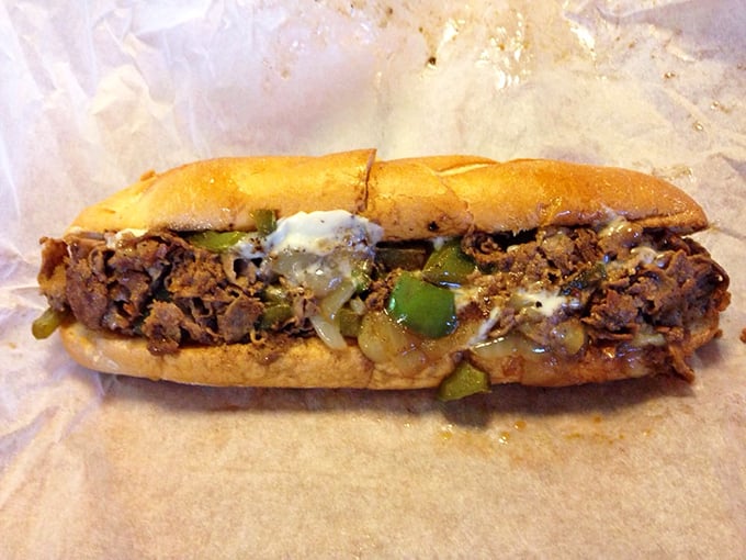 Behold the holy trinity of beef, onions, and cheese, cradled in a perfect roll. This isn't just lunch—it's edible architecture.