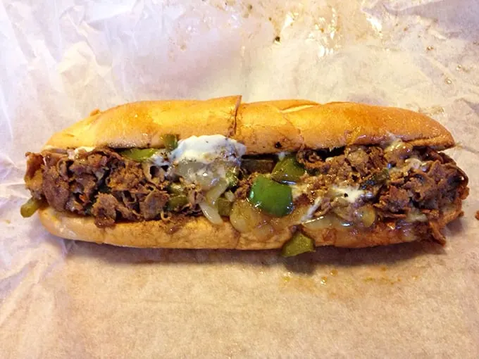 Behold the holy trinity of beef, onions, and cheese, cradled in a perfect roll. This isn't just lunch—it's edible architecture.