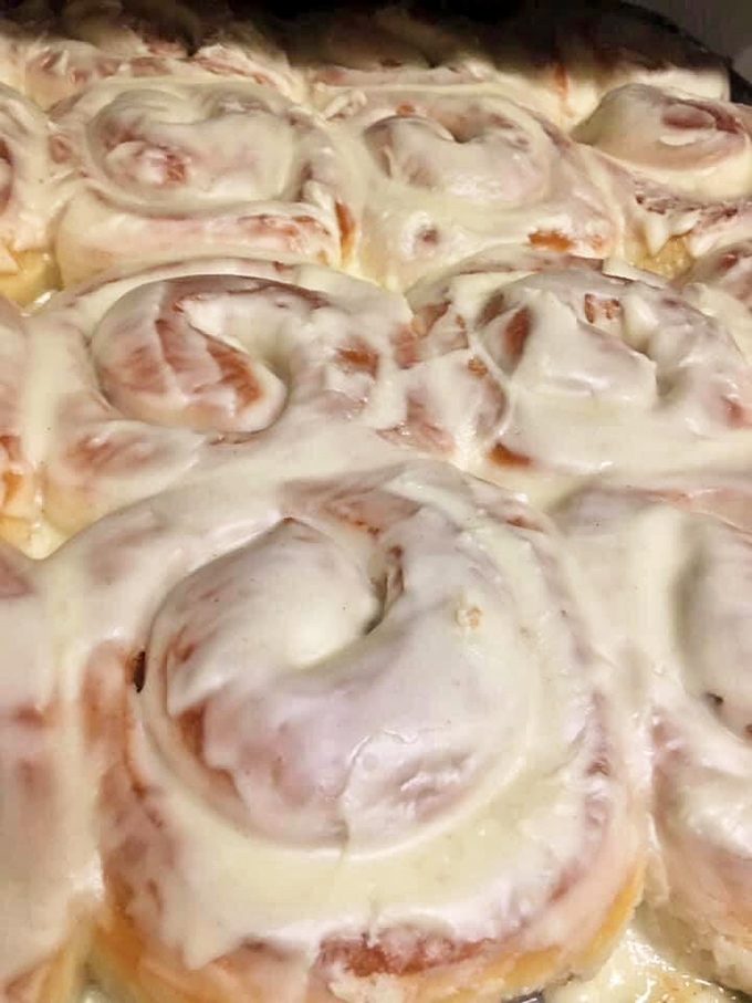 These aren't just cinnamon rolls—they're fluffy spirals of joy topped with a glaze so perfect it could make angels weep.