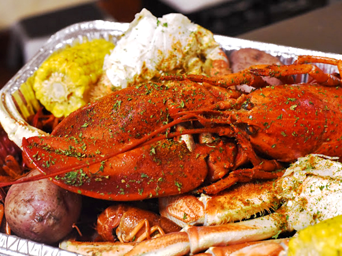 This isn't just a crab—it's a flame-red crustacean celebrity, seasoned with enough spice to make you think Columbia suddenly borders the Gulf.