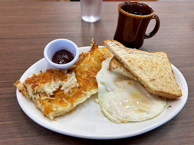 This is what breakfast commitment looks like—an omelet that took its job seriously and hash browns with a perfect crisp-to-fluff ratio.