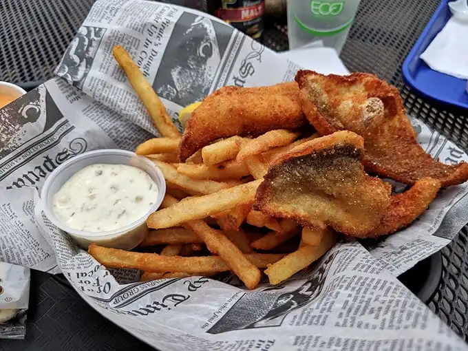 Golden-battered fish that shatters with each bite, nestled alongside fries that could make a French chef weep. This isn't fast food—it's food worth slowing down for.
