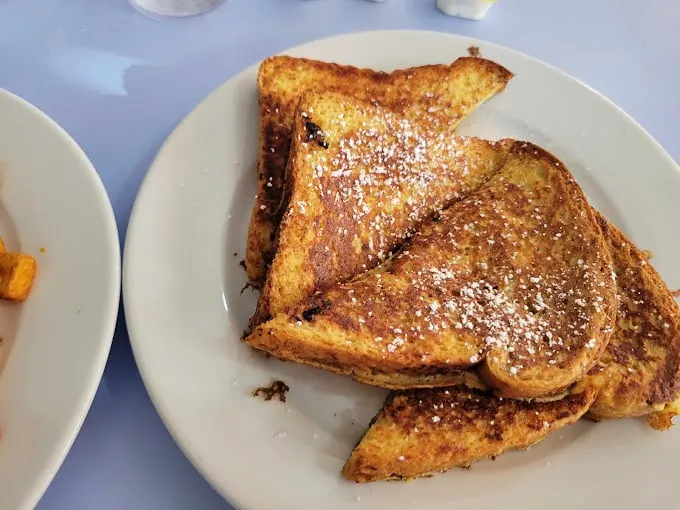 French toast that's achieved the golden-brown perfection scientists are still trying to replicate. Powdered sugar sprinkled like the first snow of winter.