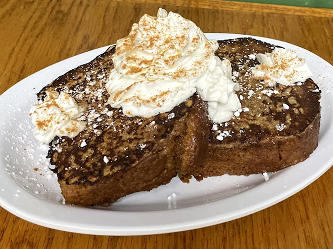 French toast that doesn't need a filter—just your immediate attention. That whipped cream mountain isn't going to climb itself.