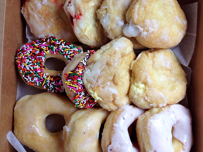 A box of joy! The sprinkled one is winking at you, while those glazed beauties are practically begging to be devoured.