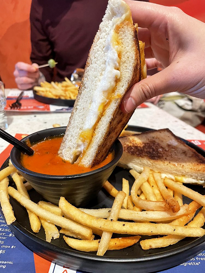 The grilled cheese at Mercury doesn't just melt in your mouth—it melts your worries away, with that perfect golden crust hiding a treasure of gooey goodness.