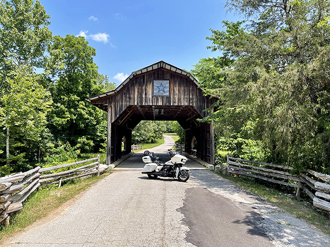 Not all who wander are lost—especially at this rustic covered bridge where motorcyclists and photographers find equal measures of Ozark magic.