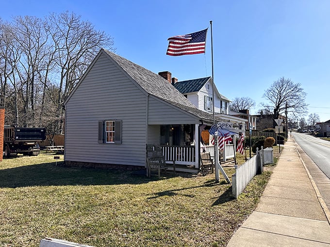 History doesn't just live in museums here—it's where actual living happens. This charming cottage with its American flag feels like stepping into a Norman Rockwell painting.
