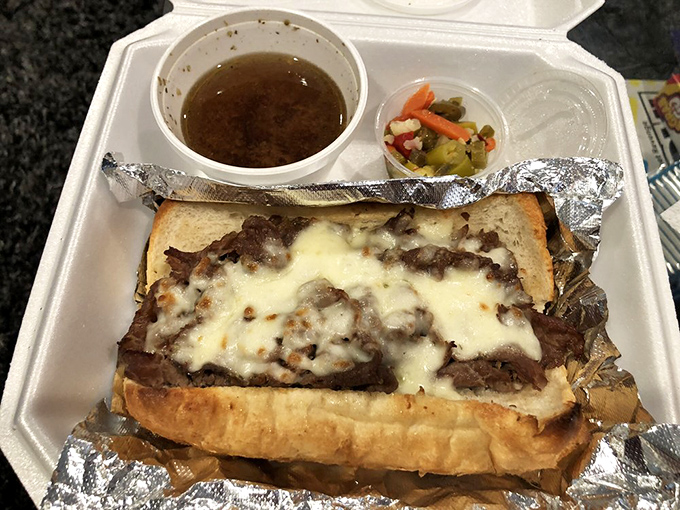 Italian beef sandwiches aren't just food; they're an engineering marvel. Tender meat, melty cheese, and that essential cup of jus for dunking—perfection on styrofoam.