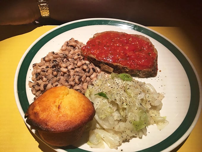 That famous meatloaf, crowned with tangy tomato sauce, sits alongside black-eyed peas and cabbage – a Southern trinity of comfort.