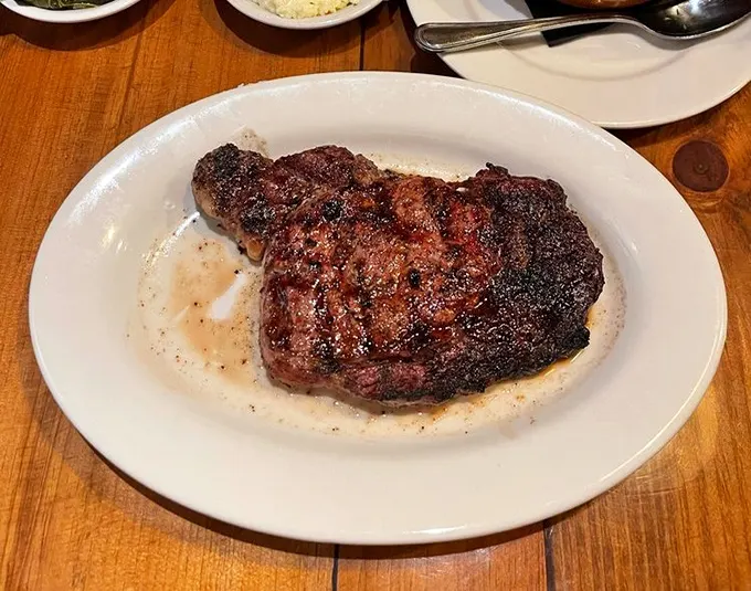This ribeye isn't just cooked, it's been transformed—the perfect char telling stories of flame and patience.