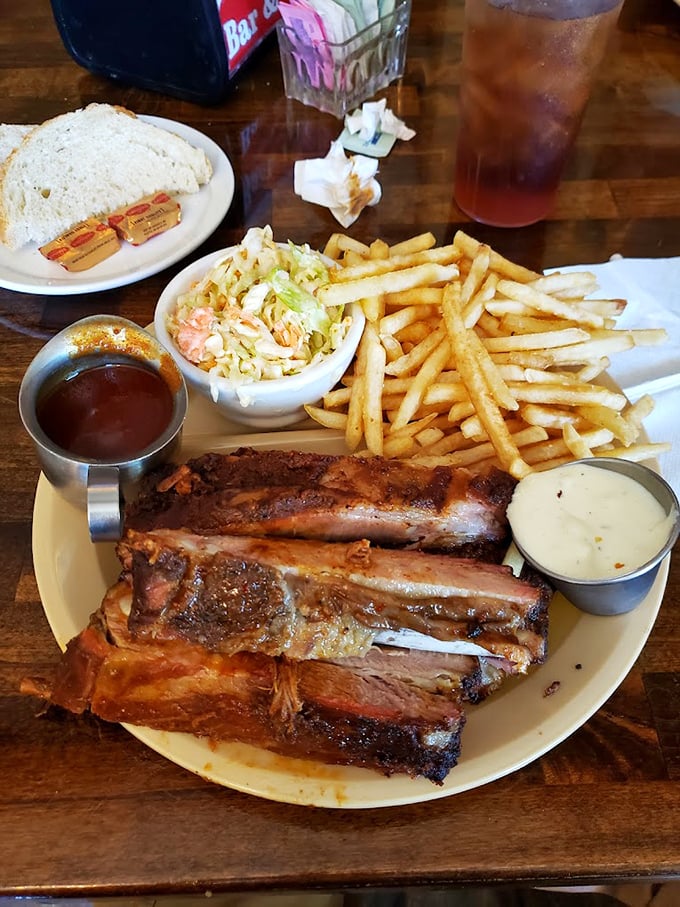 Meat so tender it surrenders at the sight of your fork, alongside fries that achieve that mythical balance between crispy exterior and fluffy interior.