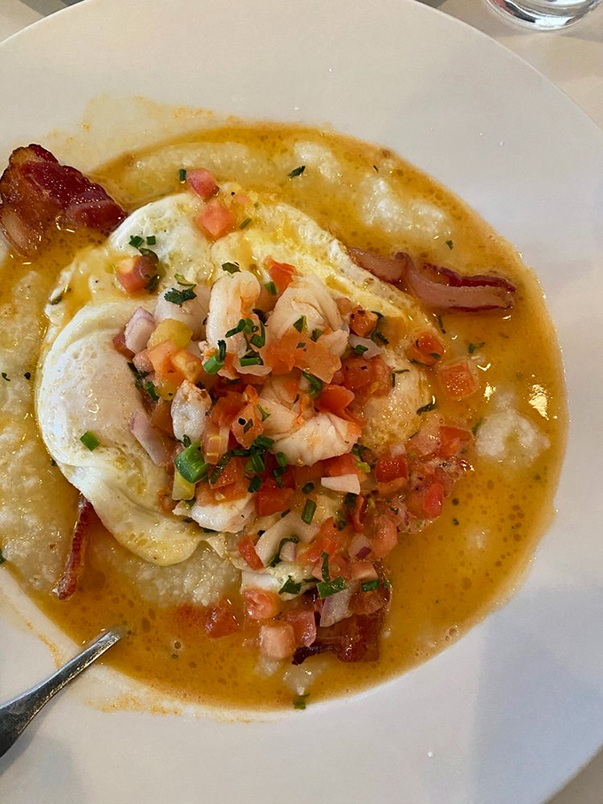 This isn't just shrimp and grits—it's a Southern hug in a bowl. The eggs and pico de gallo crown this creamy masterpiece like jewelry on royalty.