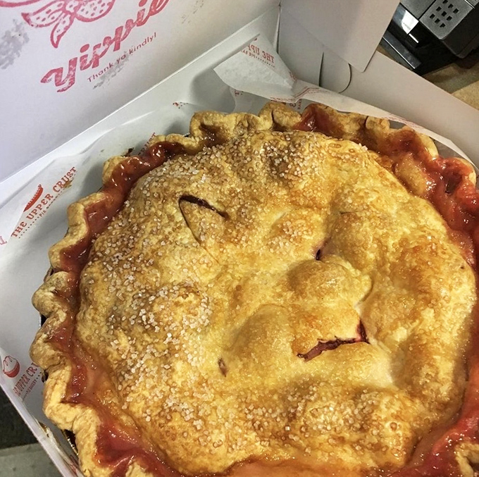This strawberry rhubarb masterpiece isn't just a pie—it's summer captured in a pan. The golden crust and ruby filling are practically winking at you.