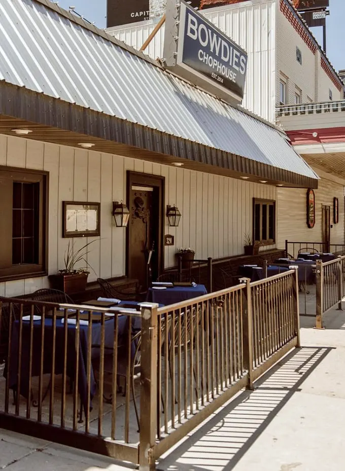 Bowdie's outdoor seating area – where summer evenings and sizzling steaks create memories that outlast Michigan winters.