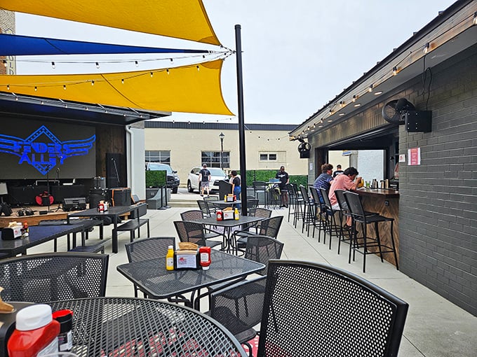 The outdoor seating area at Fenders – where strangers become friends over coffee refills and conversations about whether the weather's "hot enough for ya."