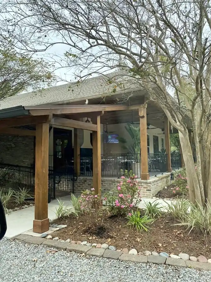 The wooded setting hints at what's cooking inside—steaks with that magical kiss of woodsmoke flavor.