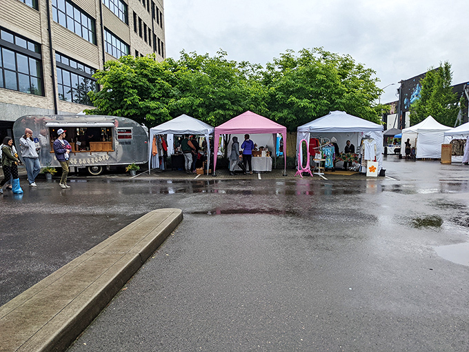 Where Portland's makers gather—handcrafted wares beneath white canopies, with the obligatory food truck waiting to refuel serious shoppers.