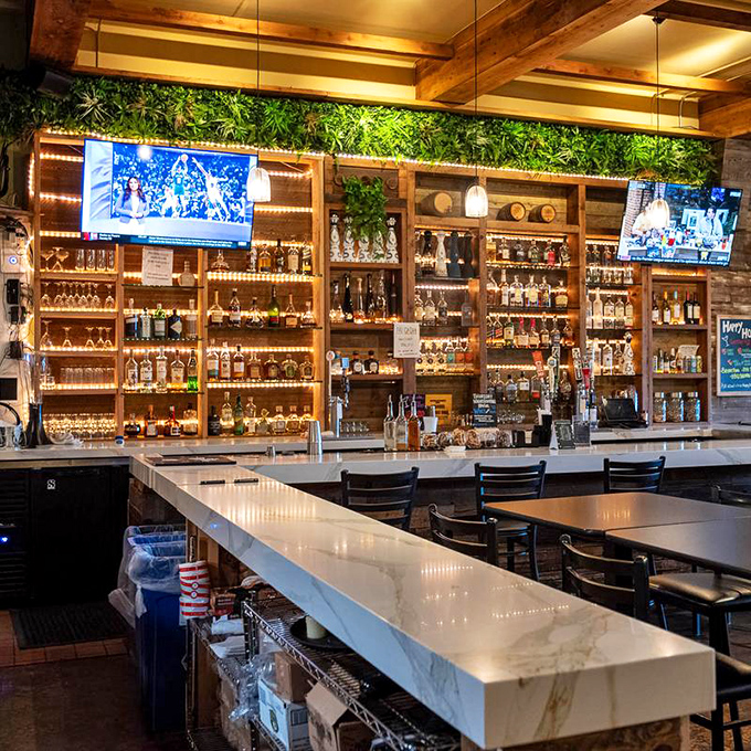 Behind those wooden walls lies a bar that proves great barbecue deserves equally impressive libations. Sunday football never had it so good.