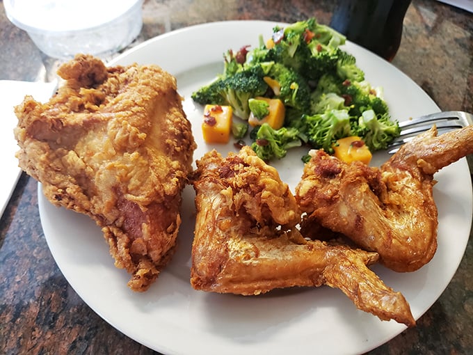 Who knew vegetables could look so happy sharing a plate with fried chicken? It's like they know they're in good company.