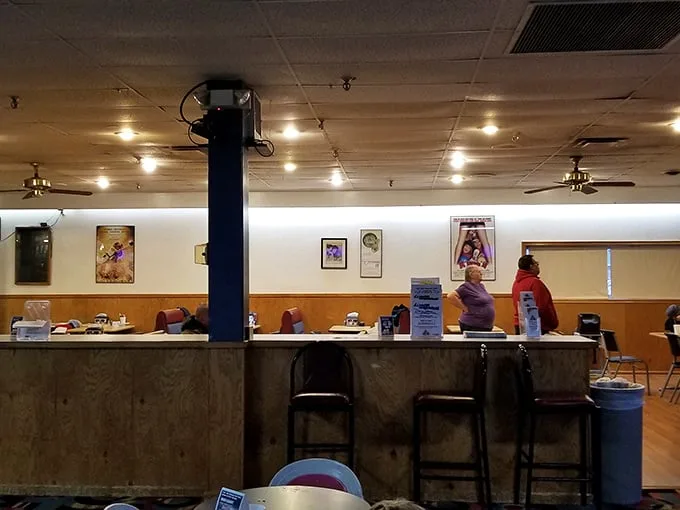 The no-frills counter area serves up bowling alley essentials—where conversations flow as freely as the beverages behind the bar.