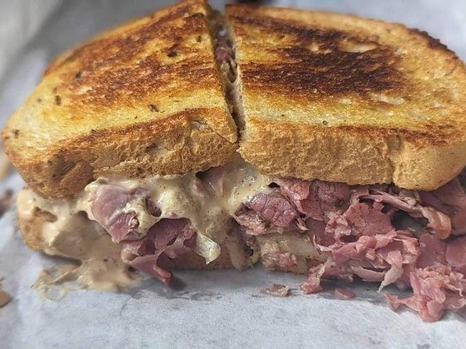 Behold the star of our sandwich dreams—toasted rye embracing corned beef in a warm hug. The meat-to-bread ratio here is what mathematicians call "perfect."