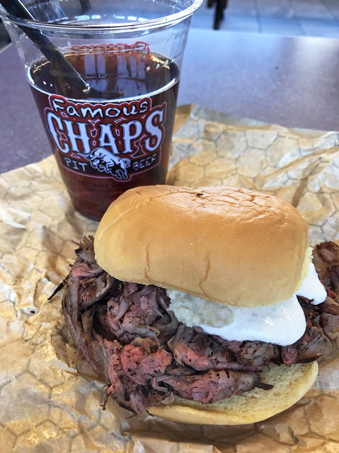The holy trinity: smoky pit beef, pillowy roll, and a cold drink bearing the Chap's logo. Some people call this lunch; I call it therapy.