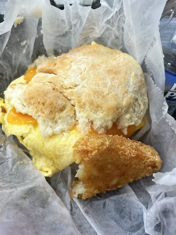 Breakfast architecture at its finest—golden biscuit cradling fluffy eggs and cheese with a perfect sausage foundation. Engineering you can eat.