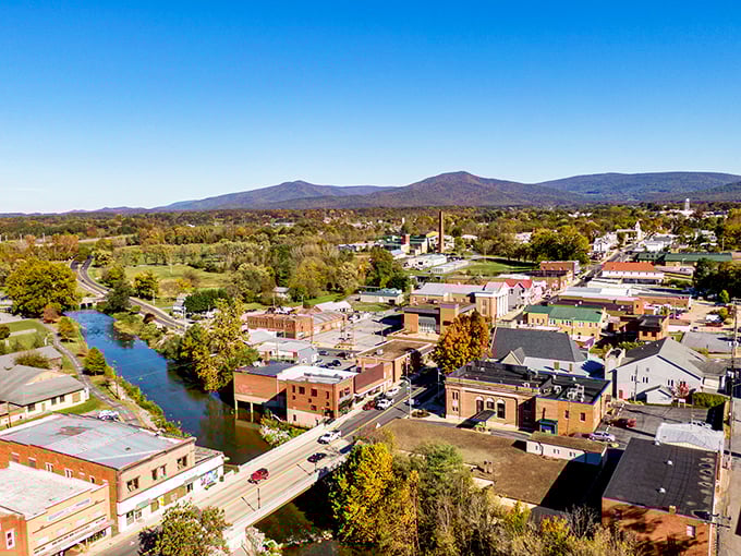 From above, Luray reveals its perfect positioning—nestled between mountains and river, a patchwork quilt of history and natural beauty.