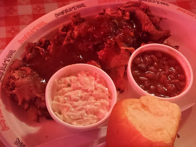 Brisket, beans, and slaw – the holy trinity of barbecue presented with zero pretension and maximum flavor. Napkins required, not optional.